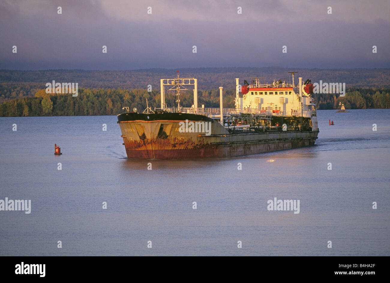 Modern day Volga Boatmen operate a small fuel tanker ship sails upriver ...