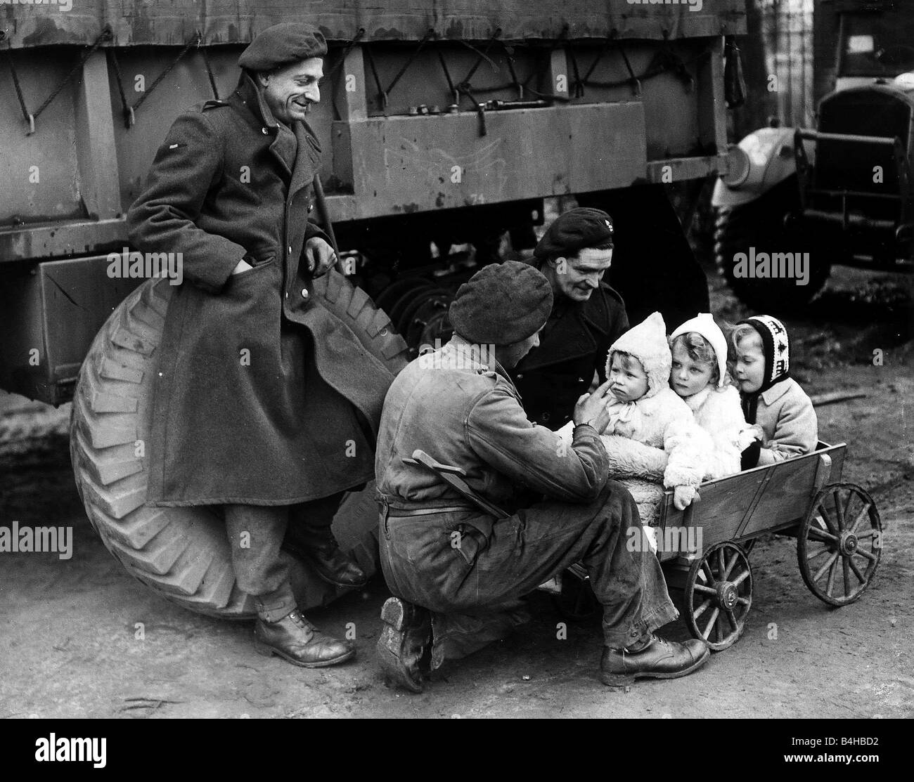 British troops with German children following the invasion of Germany ...