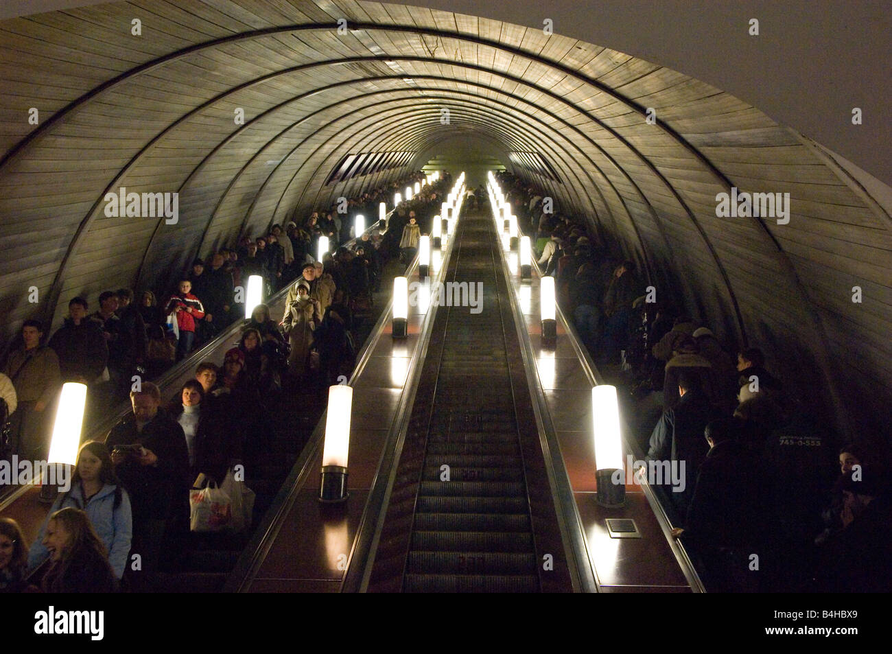 Commuters on escalator in subway station, Moscow, Russia Stock Photo ...
