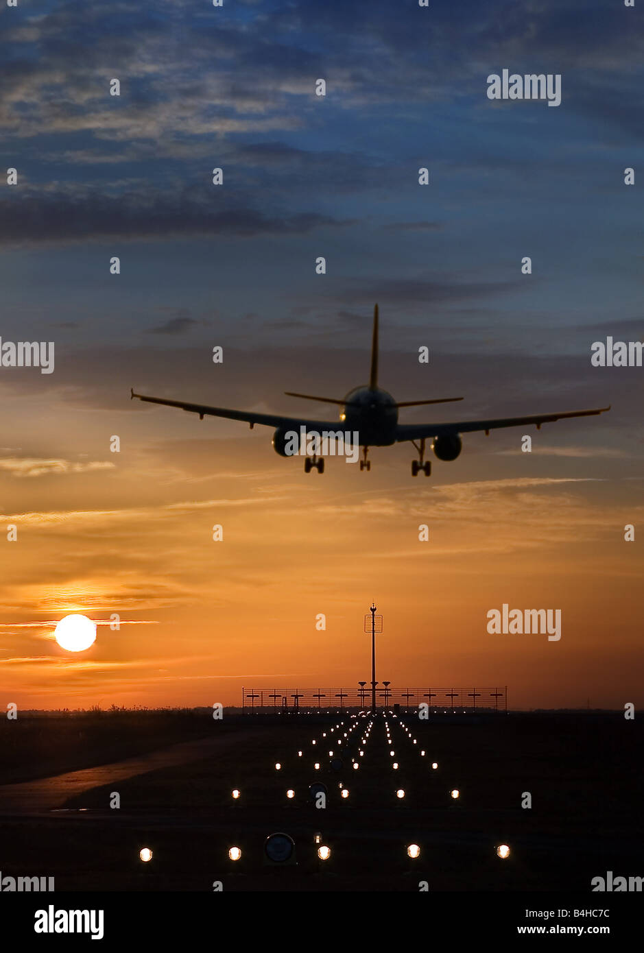Plane Landing At Sunset