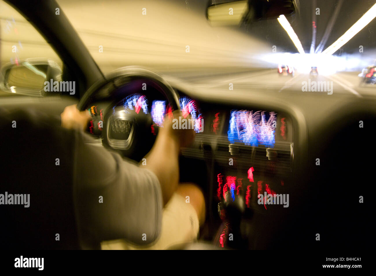 Blurred view of man driving car Stock Photo - Alamy