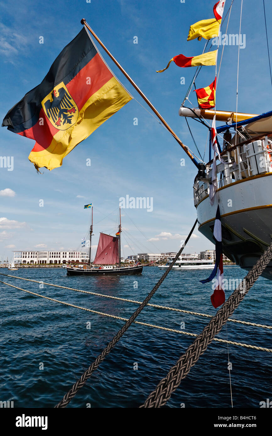 German flag on ship anchored at harbor, Warnemunde, Mecklenburg ...