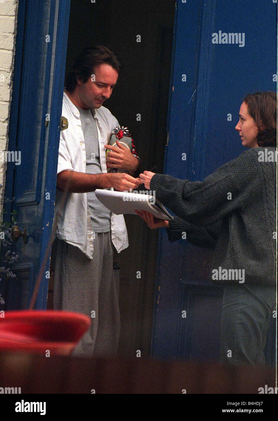 Neil Pearson takes the beer from mirror girl Polly Graham Stock Photo ...