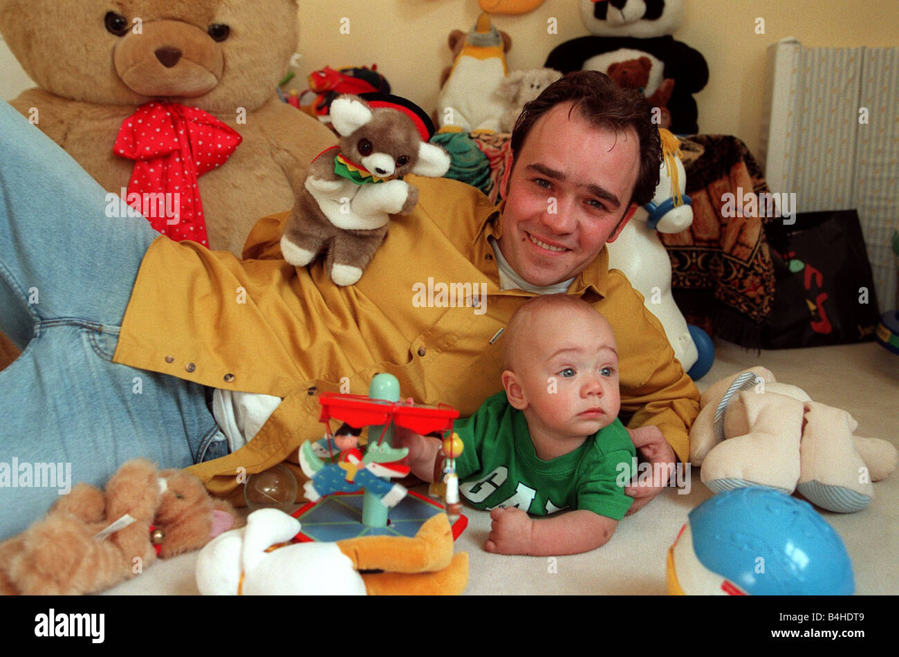 Actor Todd carty at home with baby son James 1997 Stock Photo - Alamy