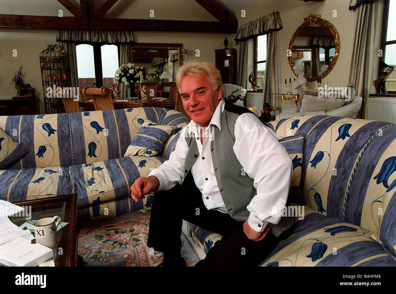 Freddie Starr Comedian Actor June 98 Sitting on blue and white sofa in ...