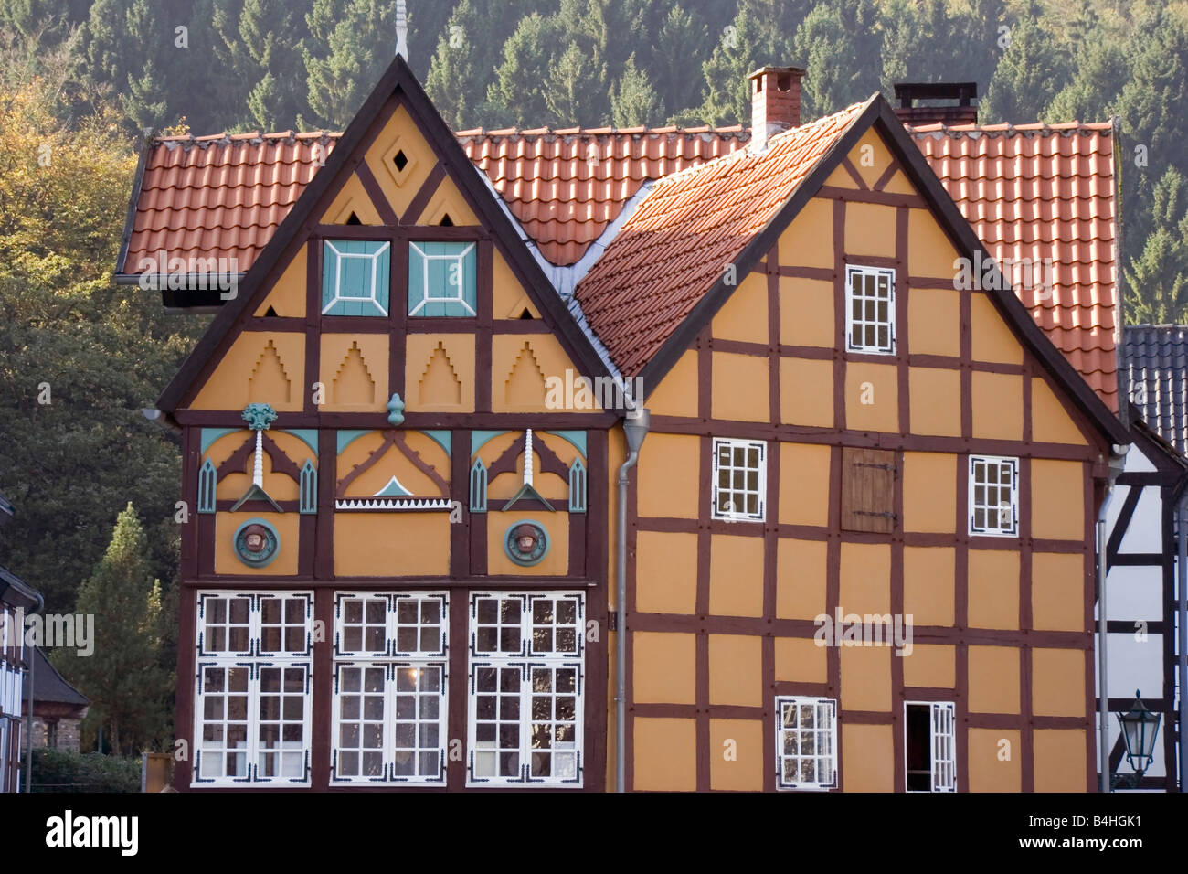 german village with timbered houses in warm sunlight and autumn colors ...