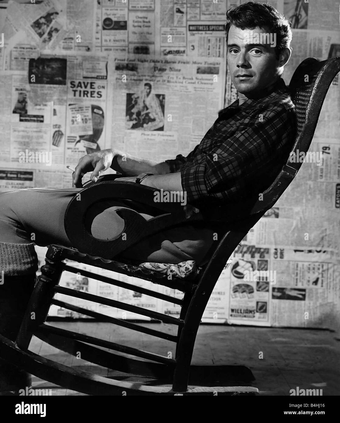 Dirk Bogarde British actor on rocking chair July1957 Stock Photo - Alamy