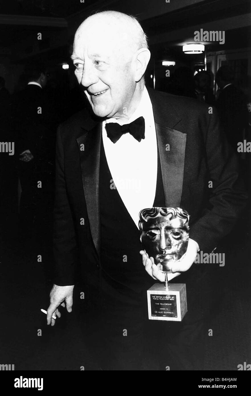 Alec Guinness actor holding BAFTA award in March 1989 Stock Photo - Alamy