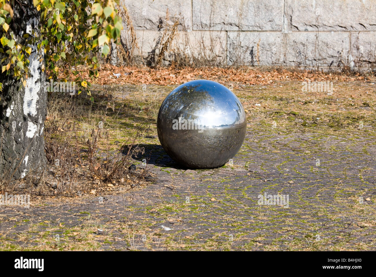 shiny steel ball on ground Stock Photo - Alamy