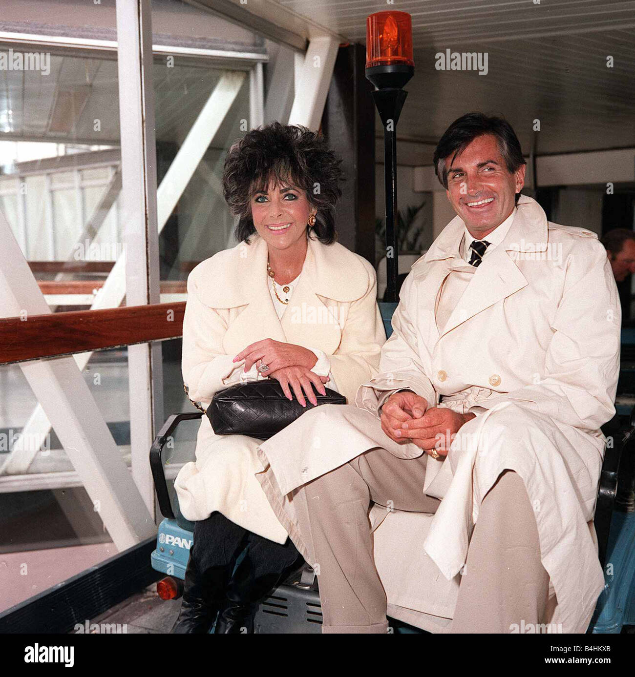 Liz Taylor actress and George Hamilton actor at London airport August ...