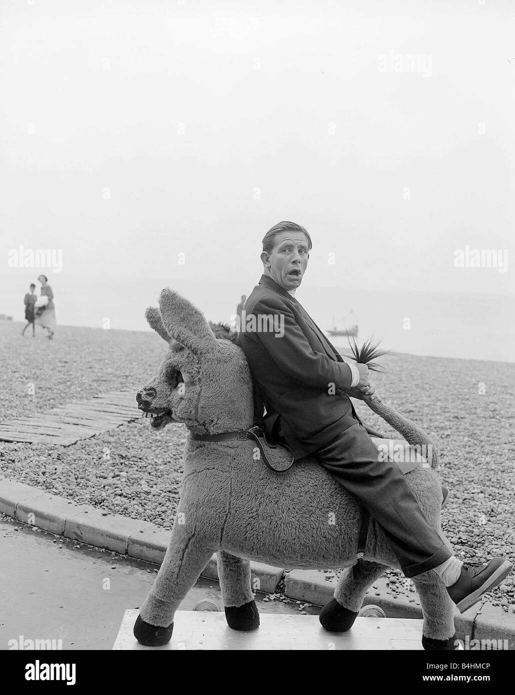 Comedian and actor Norman Wisdom photographed on Brighton Beach on a ...