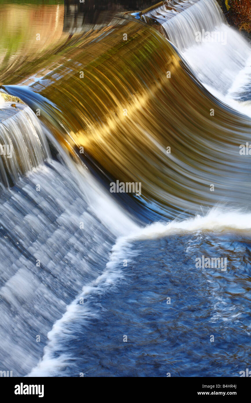 Water flowing over a weir. On the River Vyrnwy at Lake Vyrnwy, Powys ...