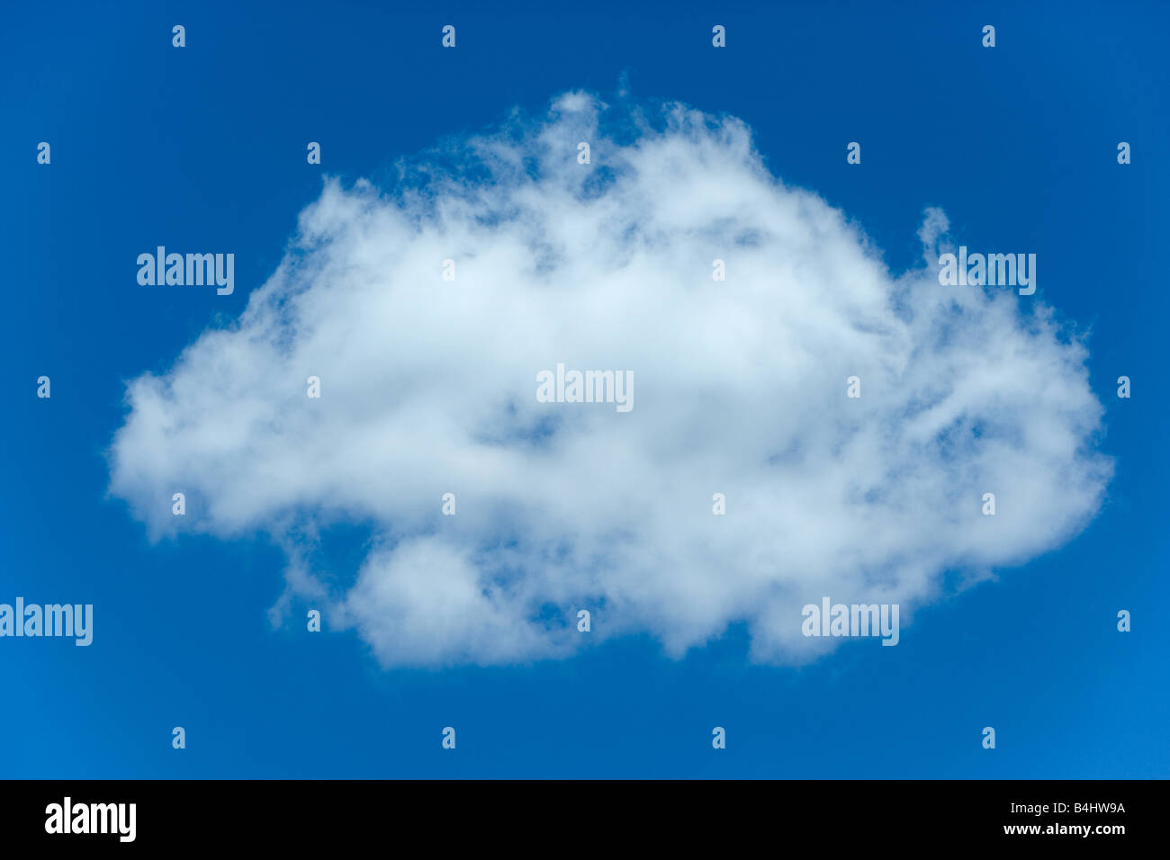 A single white cumulus cloud in a blue sky Stock Photo - Alamy