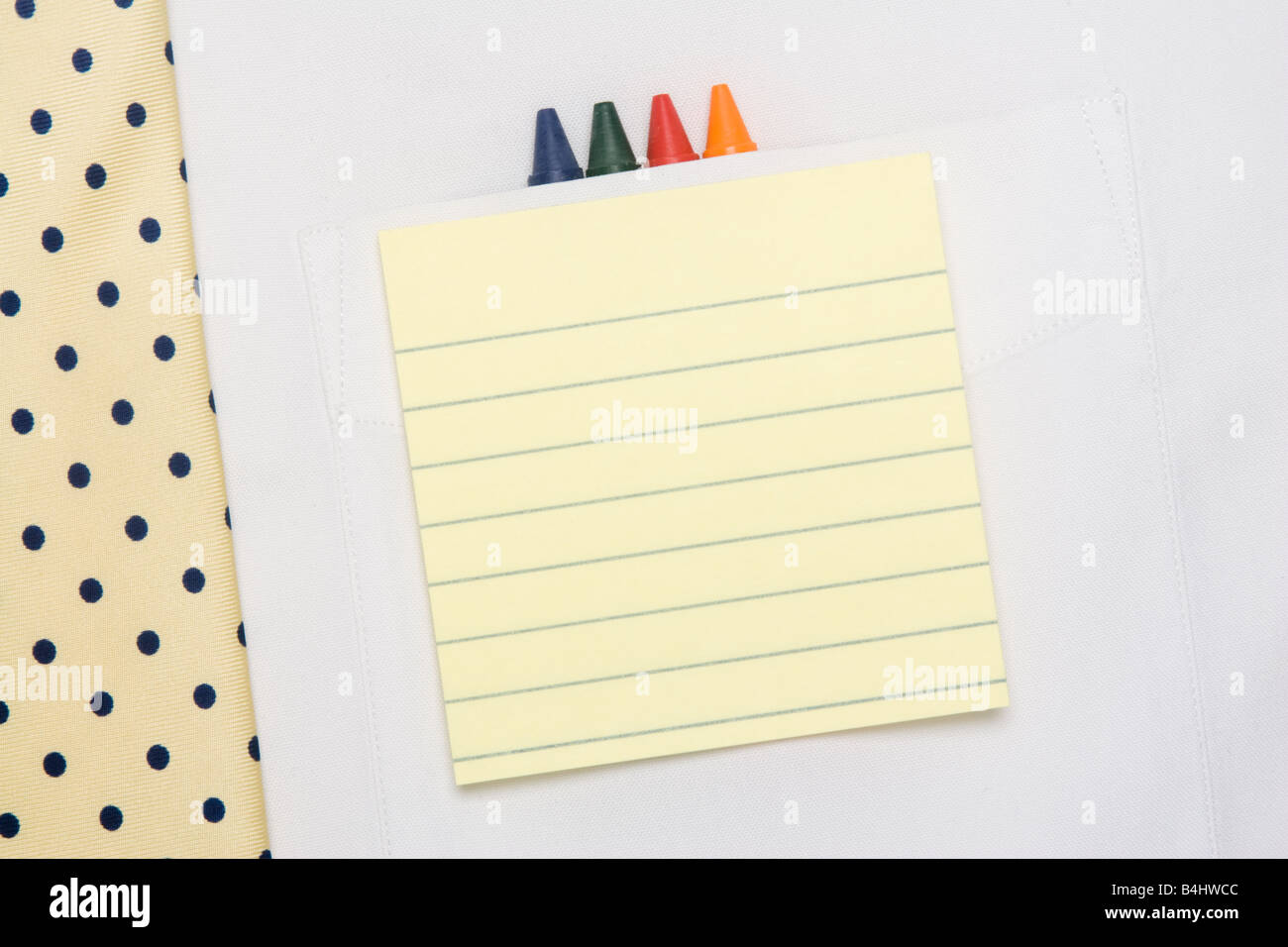 Close up of yellow lined sticky note, yellow polka dot necktie and 4 ...