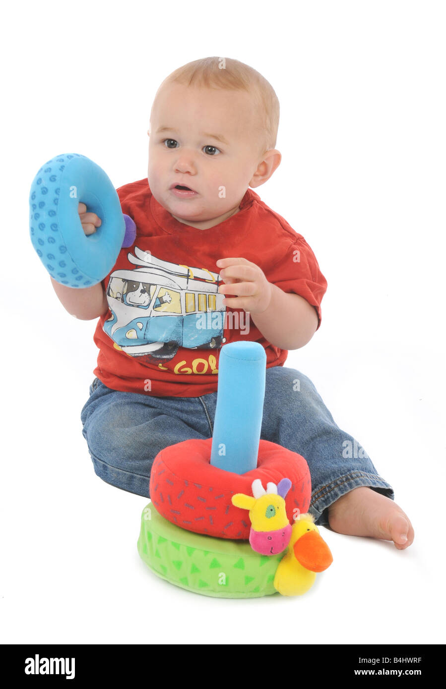 A baby learning to sit-up, crawl and play with toys. Development of ...