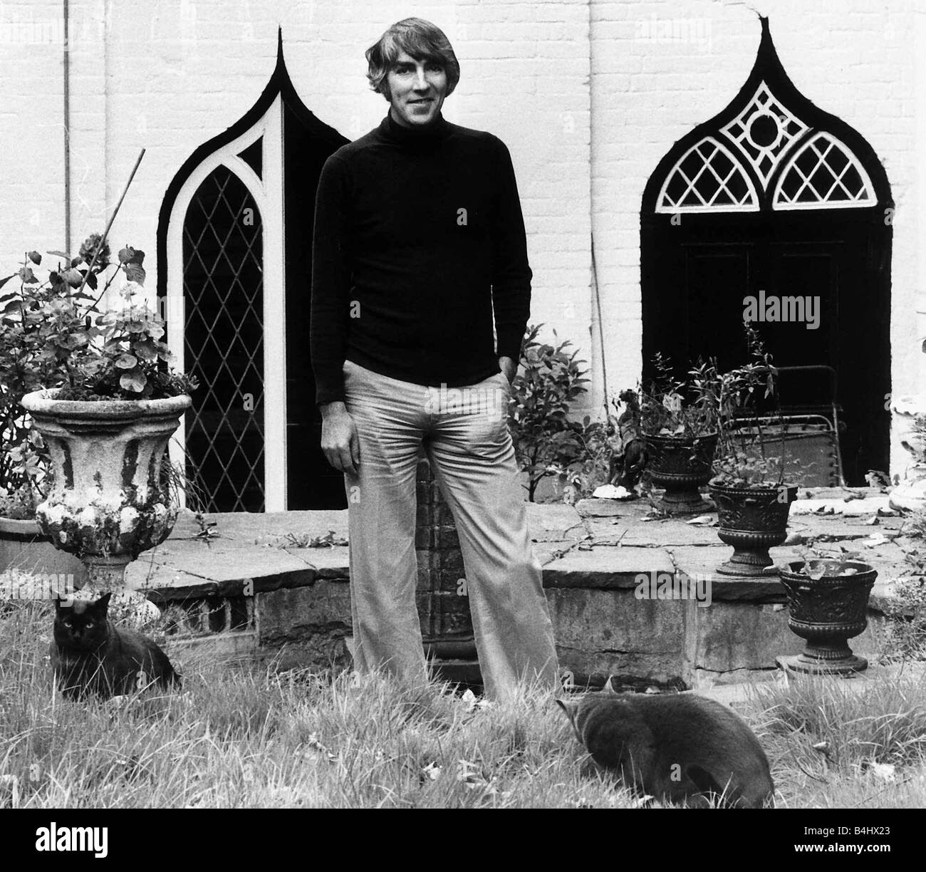 Peter Cook comedian actor outside house 1975 Stock Photo - Alamy