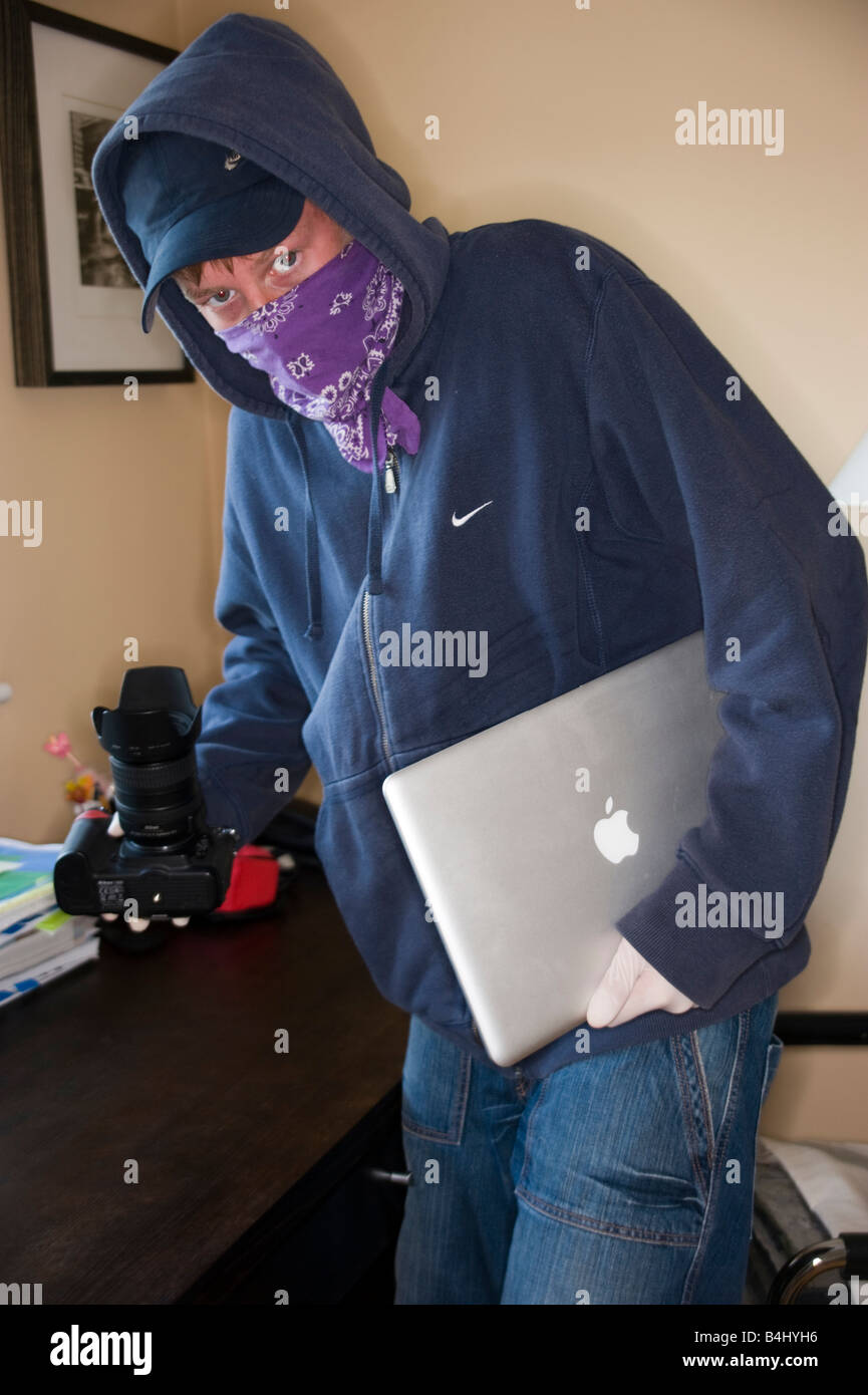 teenage boy stealing valuables from a house Stock Photo - Alamy