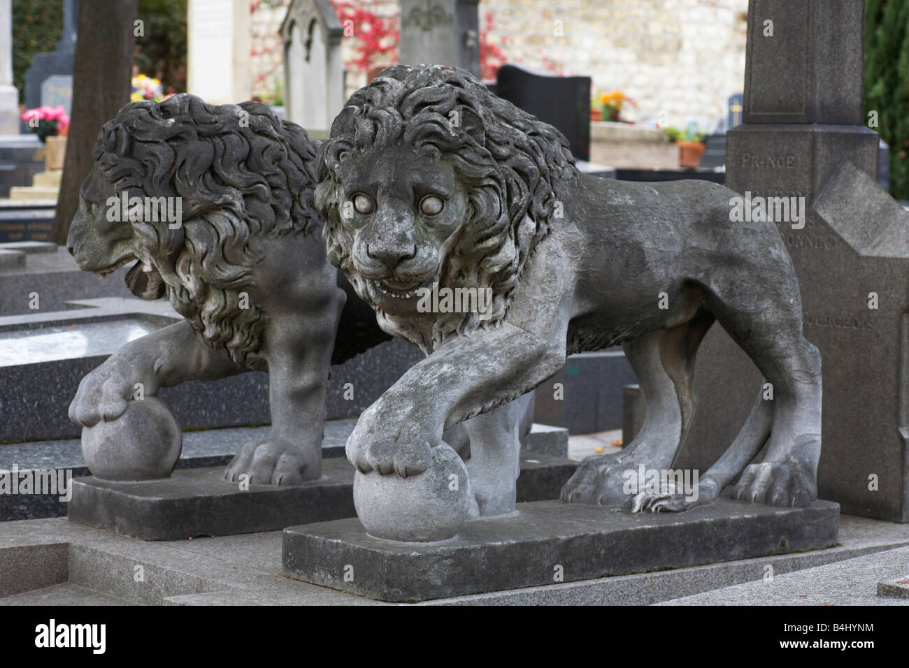 Lion sculptures on grave in Montparnasse Cemetery Paris France Stock ...