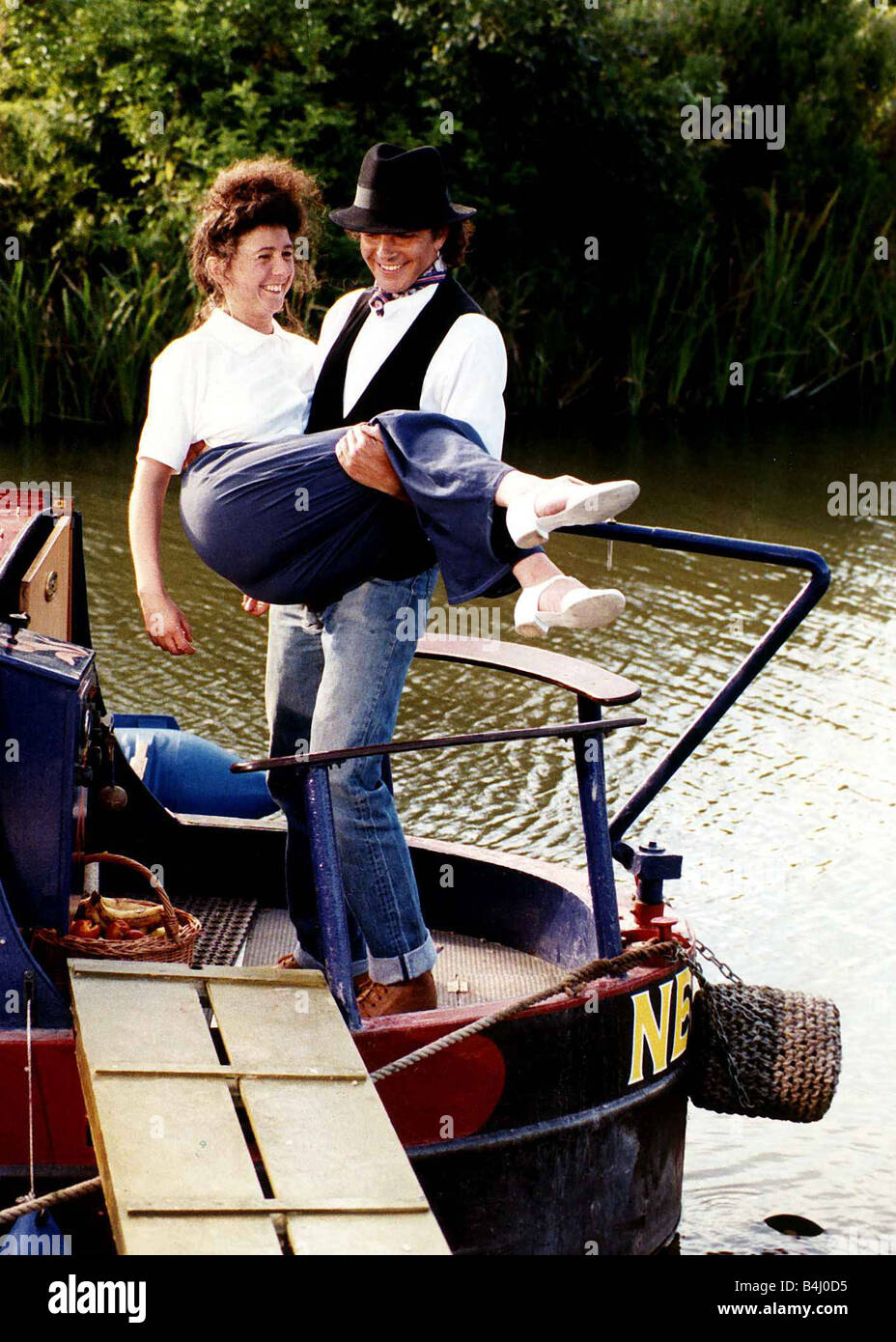 David Essex Singer And Actor On A Barge Boat Carring A Woman In A Scene From His Tv Series Stock