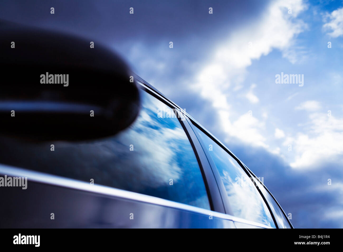 Clouds reflected in motor car Stock Photo - Alamy