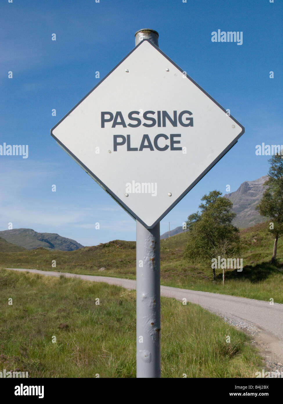 Passing place sign on narrow road, Scotland Stock Photo - Alamy