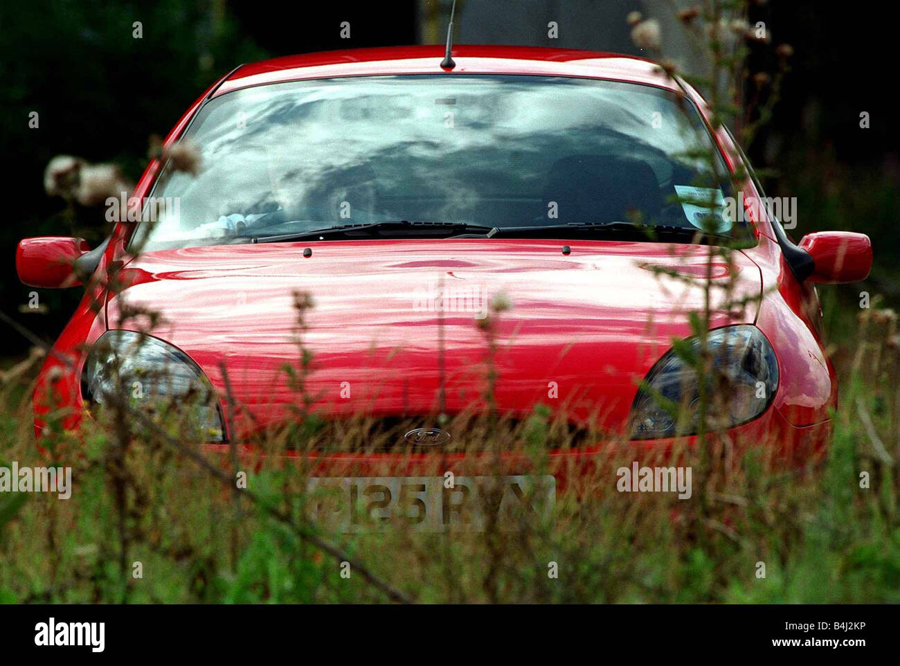 A RED FORD PUMA EXTERIOR PARKED IN GRASS AREA AUGUST 1997 Stock Photo ...