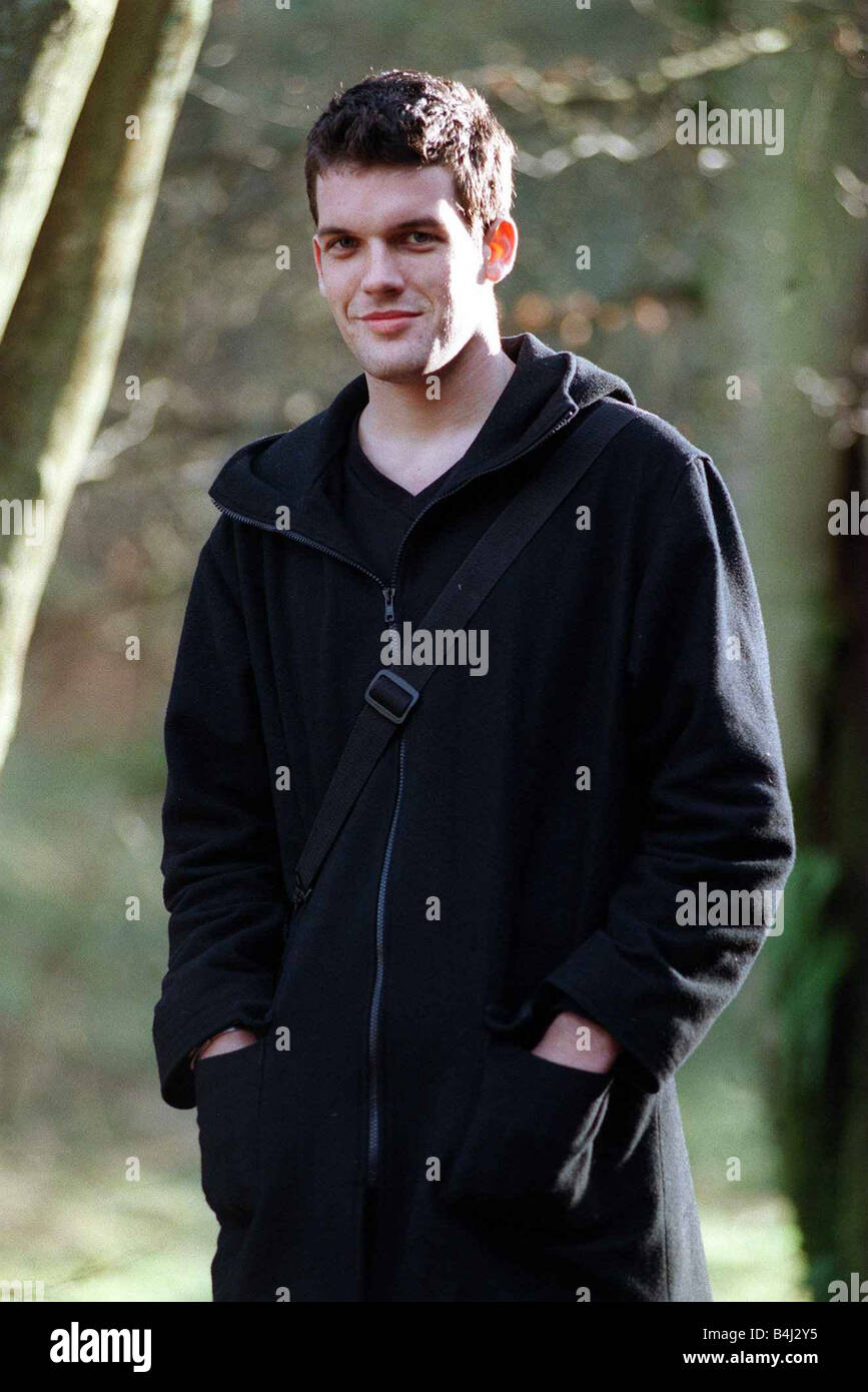 Adam Sinclair actor January 1999 in park wearing a black coat hands in ...