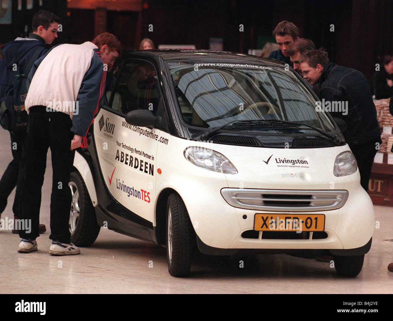 Swatch smart car in Glasgow central station January 1999 crowd looking ...