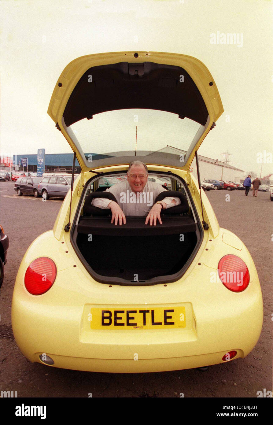 Comedian Andy Cameron April 1999 sitting inside a Volkswagen Beetle ...