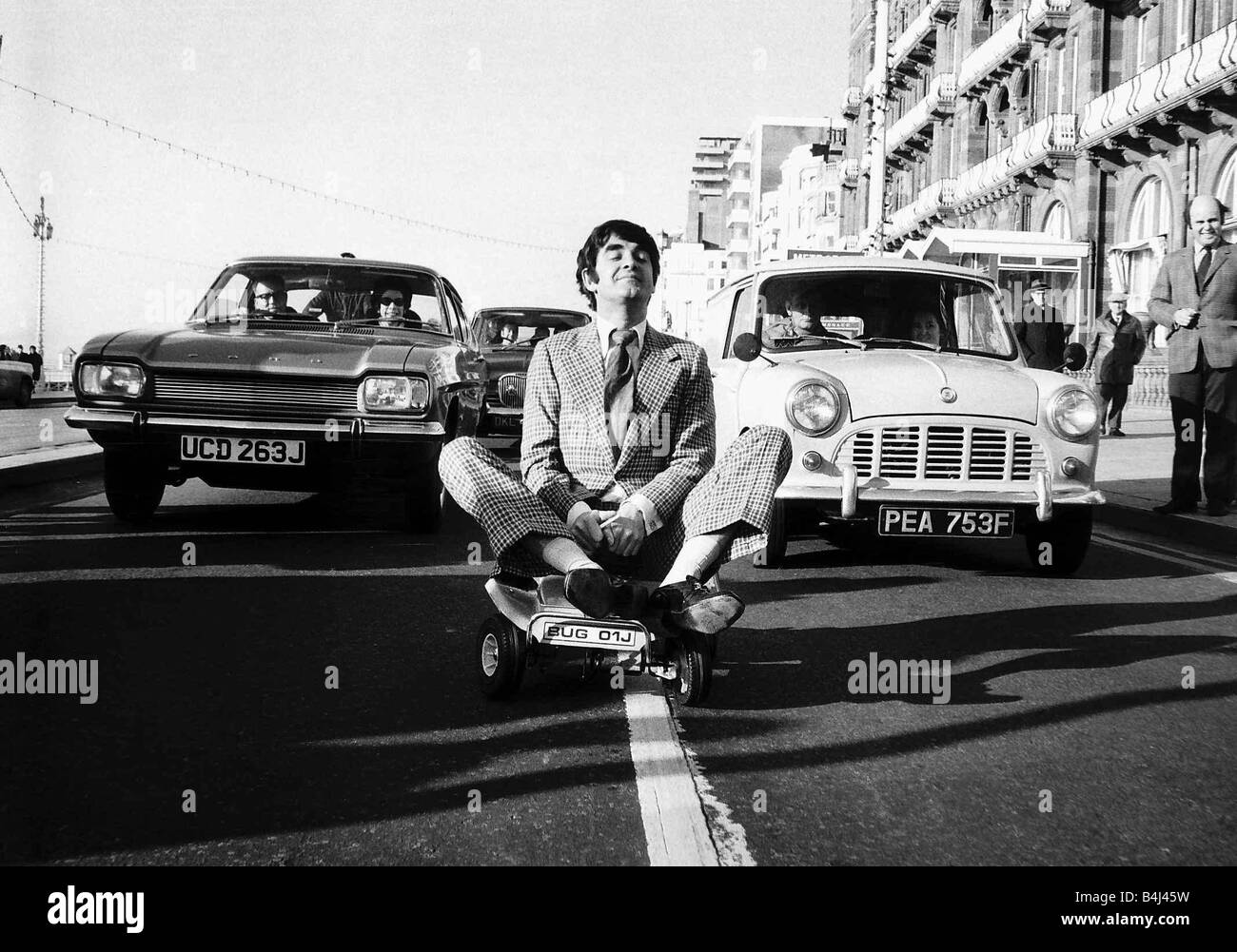 Derek Nimmo actor in Brighton riding a toy car dbase msi Stock Photo ...