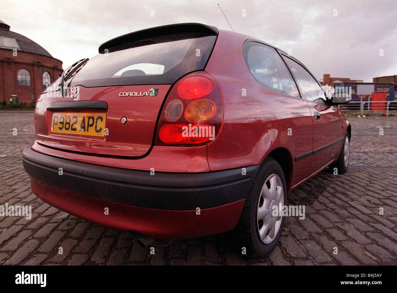Toyota Corolla Pictured from back November 1997 Red car Stock Photo - Alamy