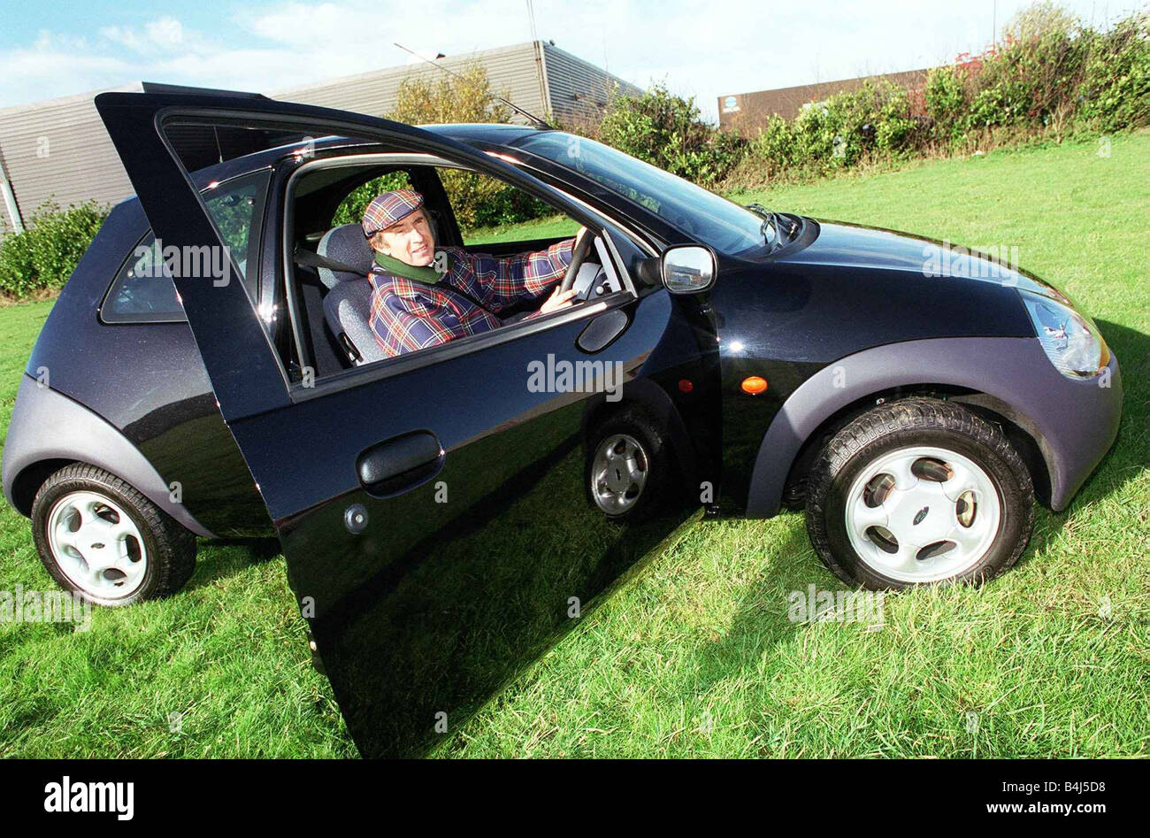 Jackie Stewart with his Ford Ka car January 1998 drivers door ajar ...