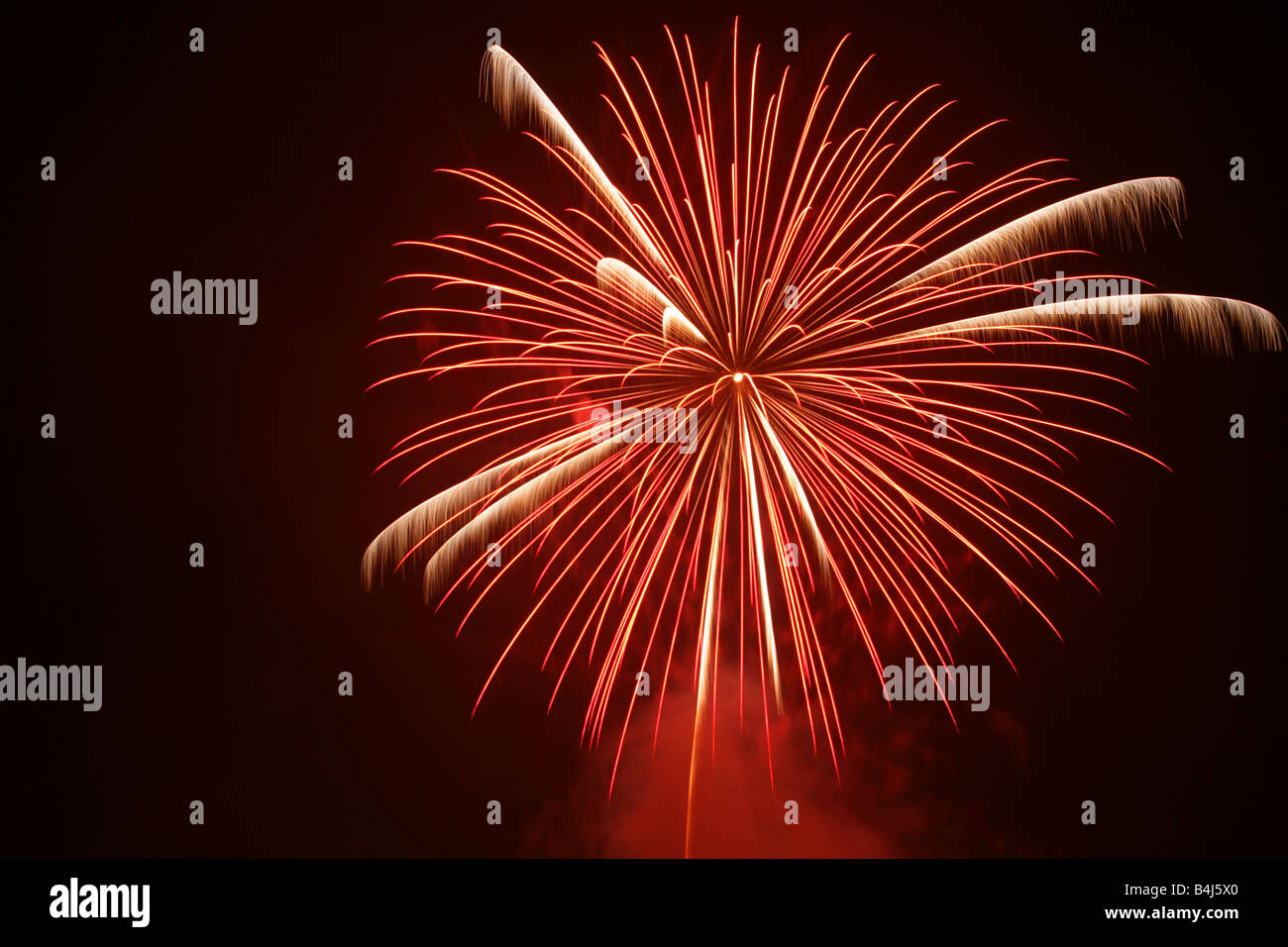 Red exploding firework Stock Photo - Alamy