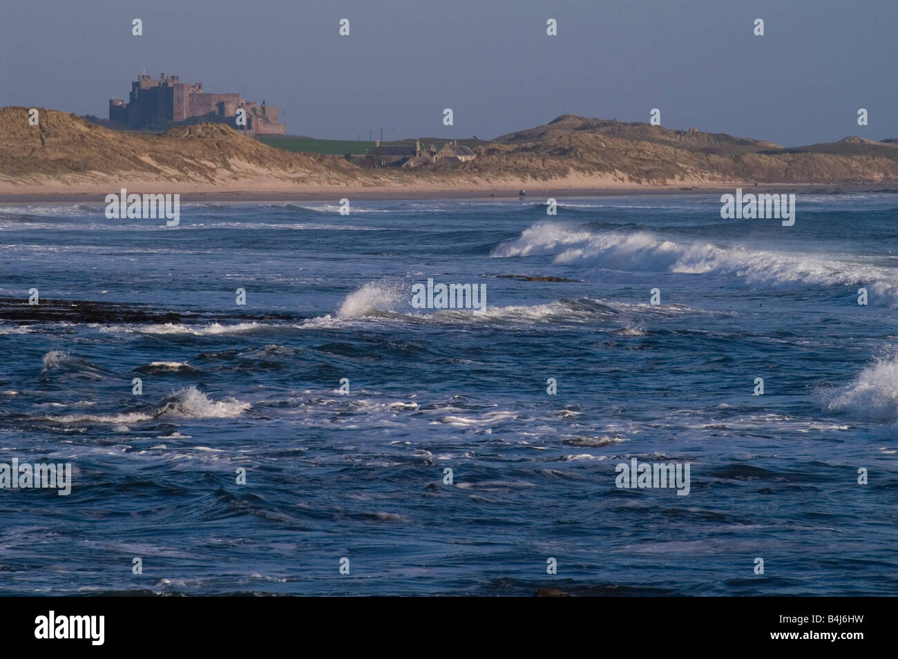 Bamburgh Castle across the sea from Seahouses Stock Photo - Alamy