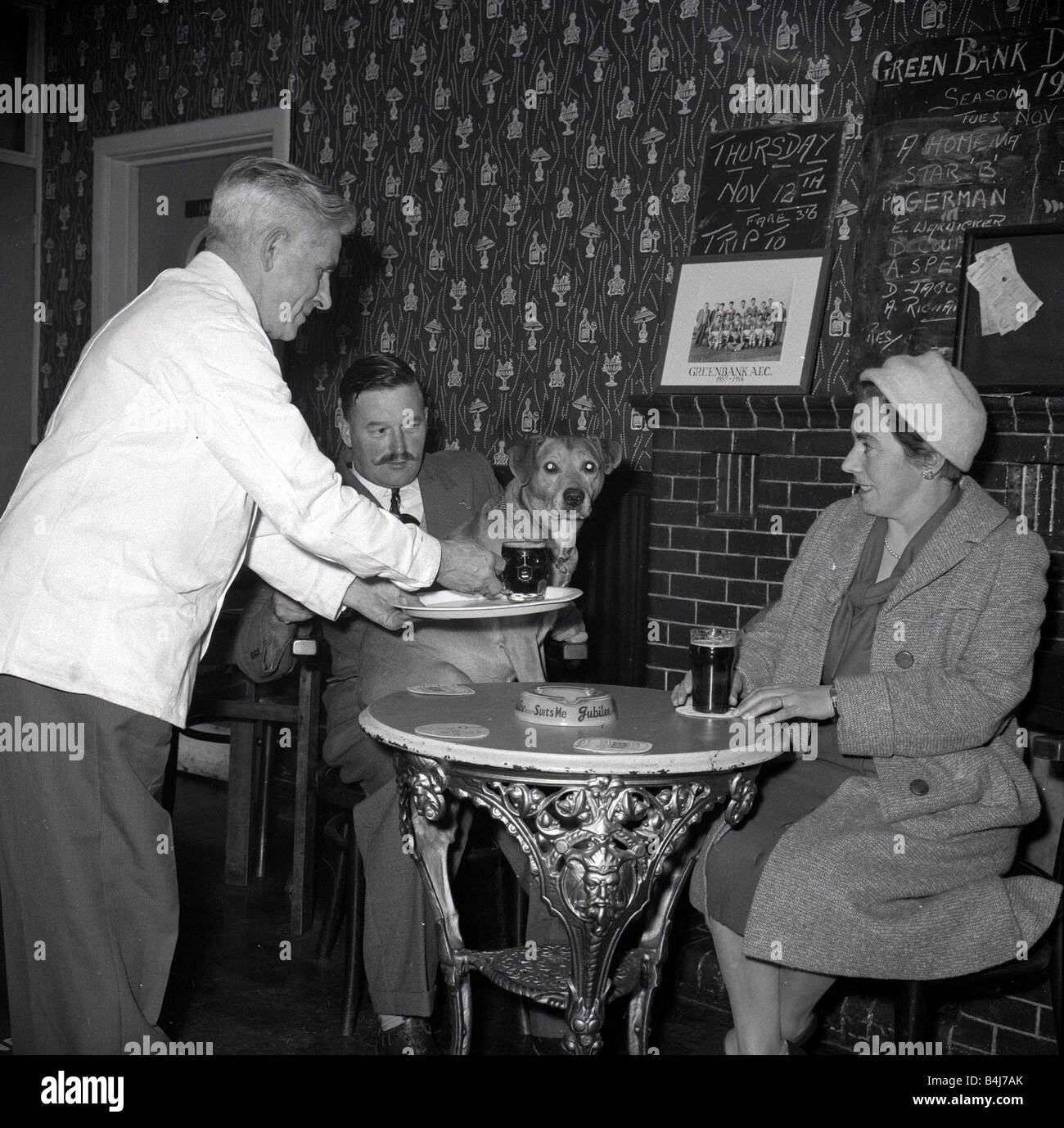 Nemo is served a pint of beer at his local pub November 1959 1950s ...