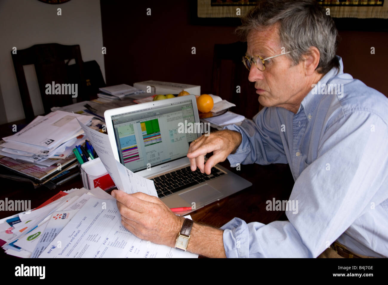 middle aged man looking stressed over finances Stock Photo - Alamy