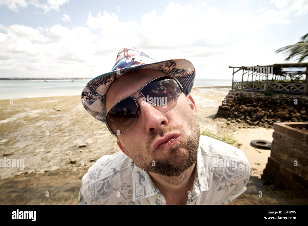 Man on holiday in a hot destination Stock Photo - Alamy