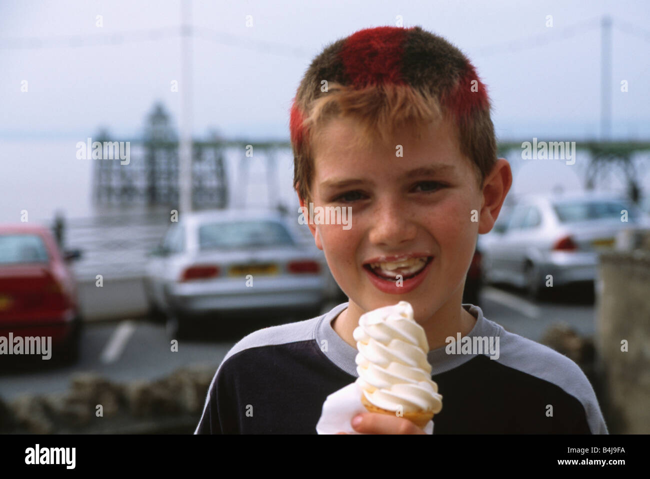 Boy with red and green dyed hair eating an ice-cream at Cleveland in ...