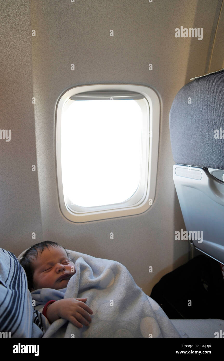three week old baby young aeroplane air berlin interior cabin flight ...