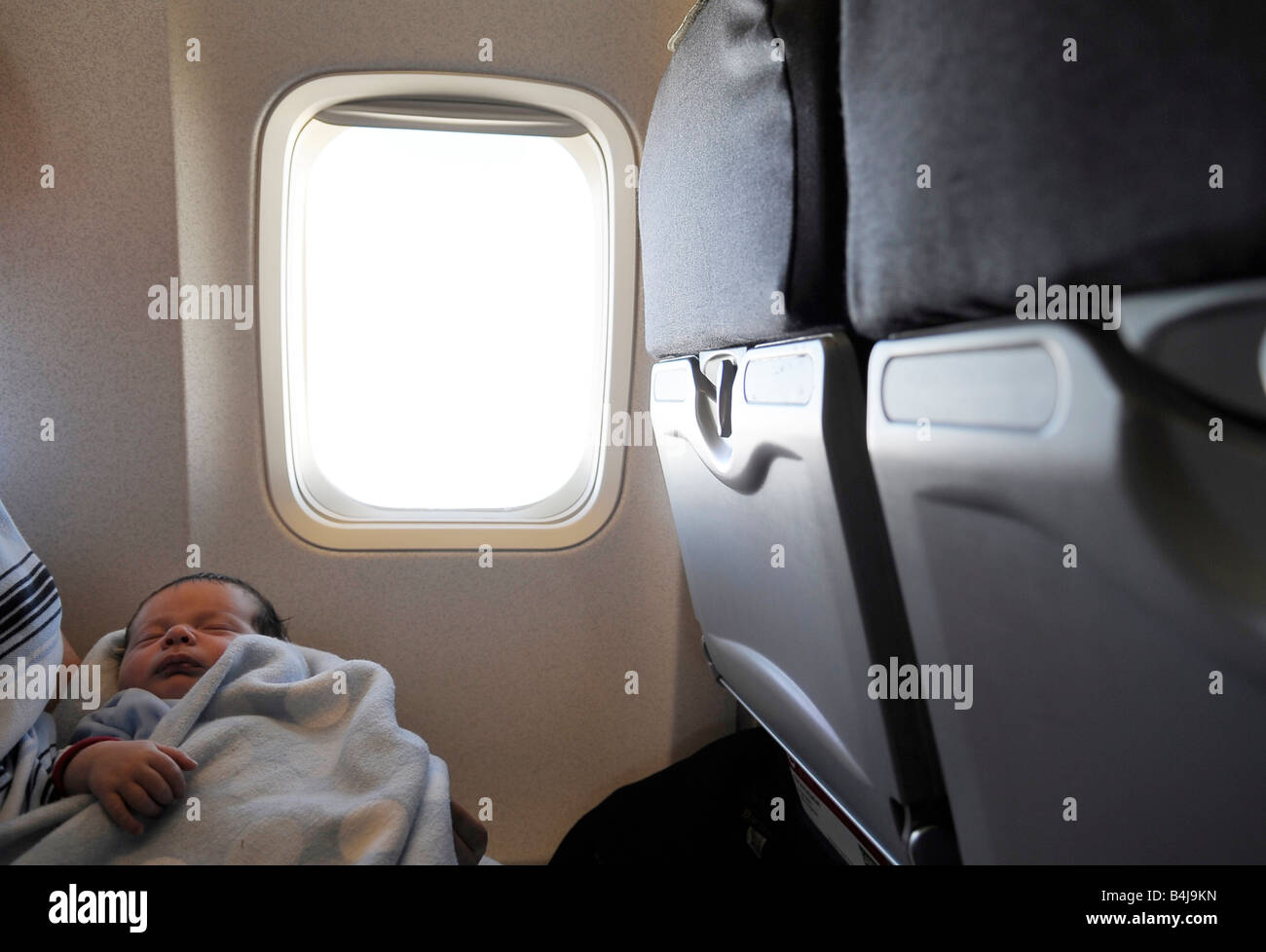 three week old baby young aeroplane air berlin interior cabin flight ...