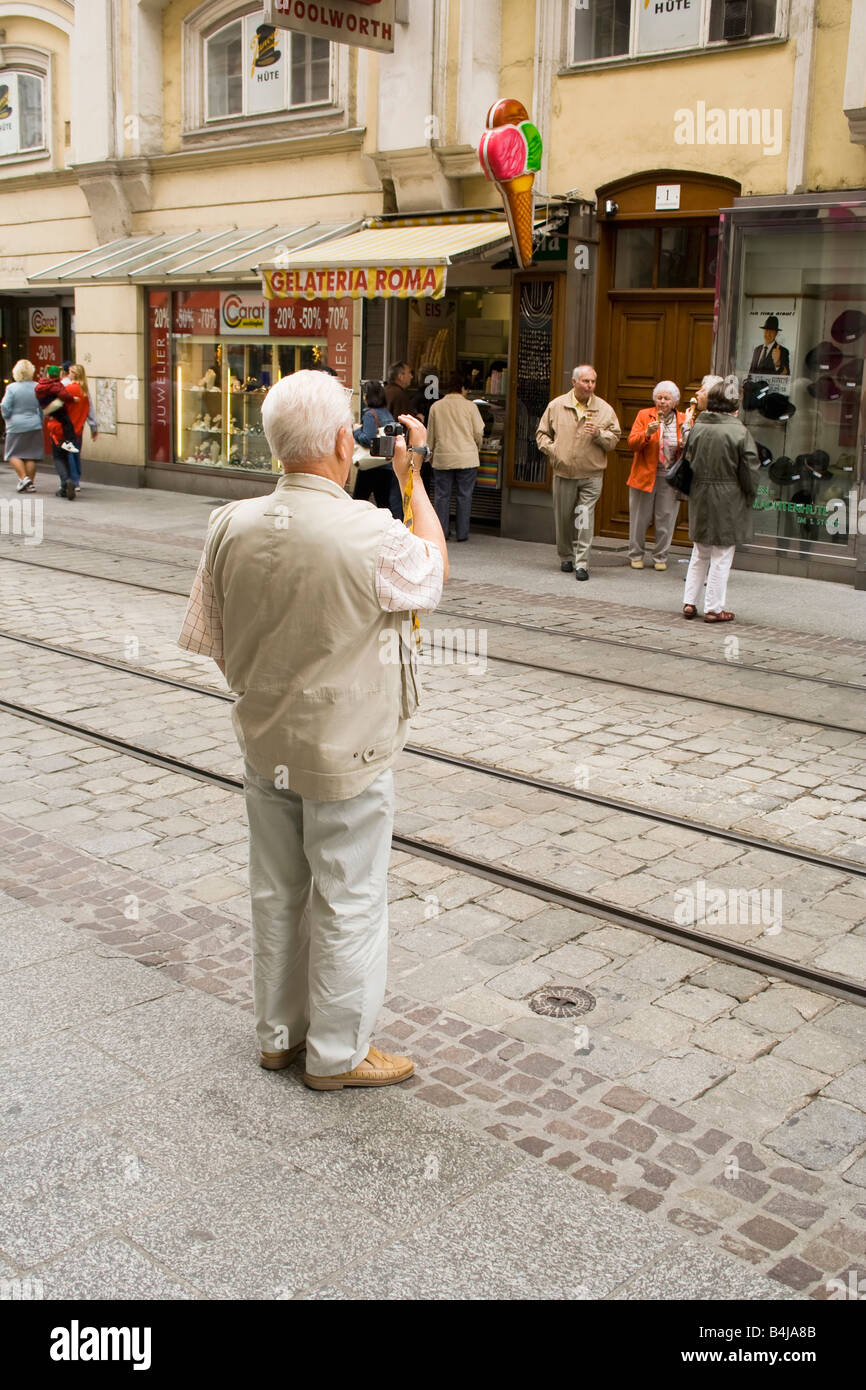 Man standing with the camera Stock Photo - Alamy