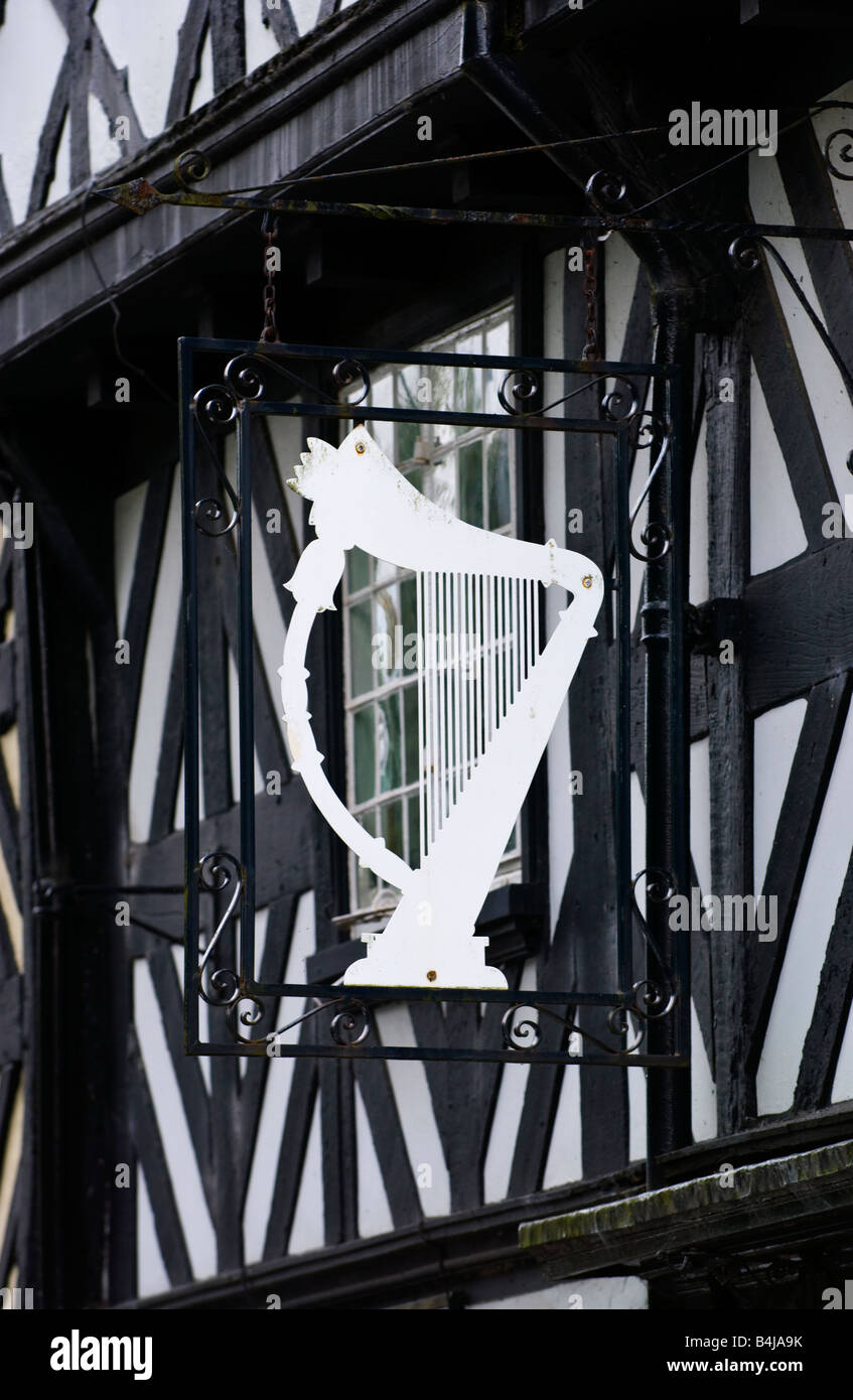 Harp sign hanging on exterior of building in Ludlow Shropshire England ...