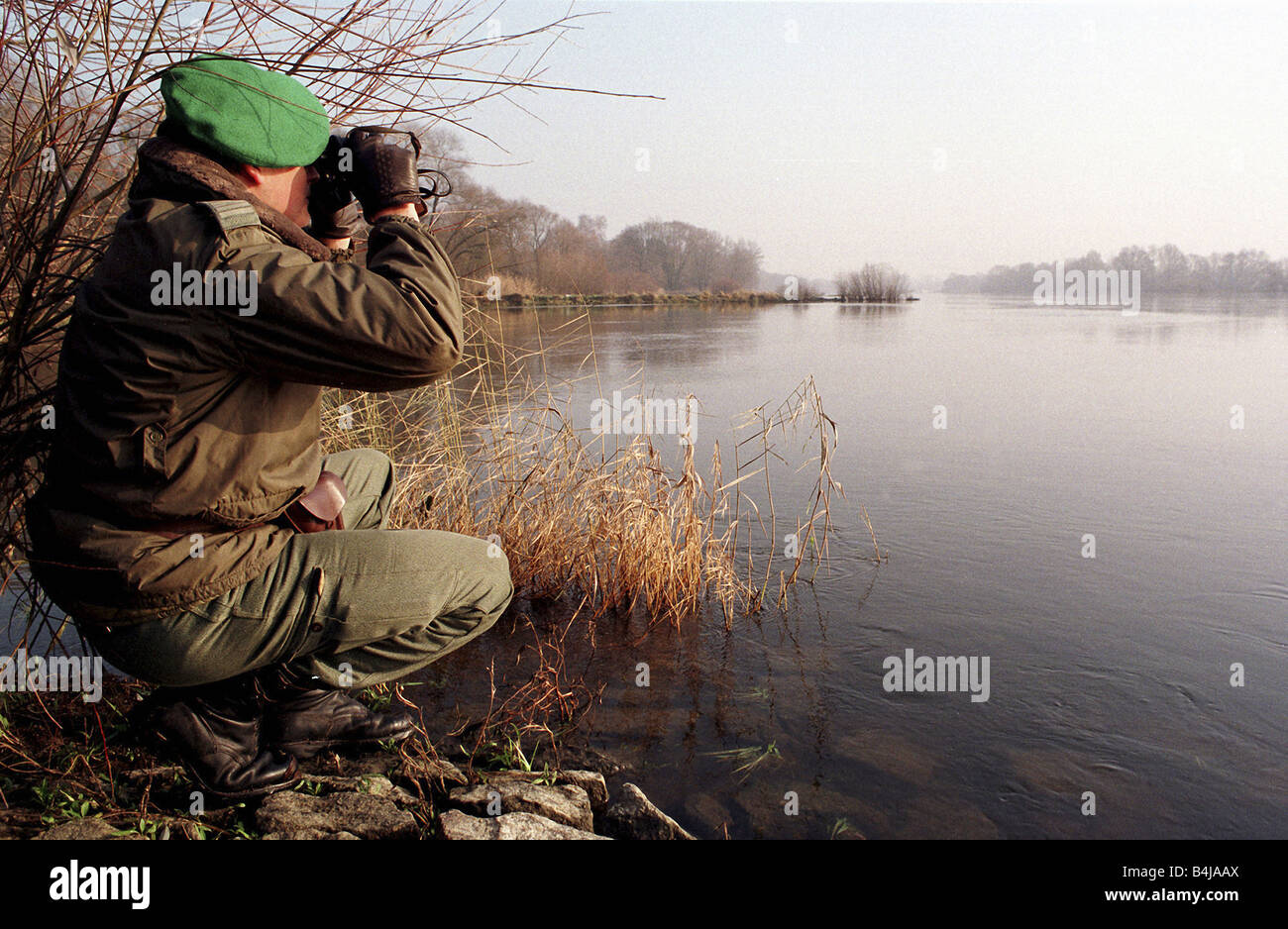 Polish border guard officer monitoring the situation at the Polish ...