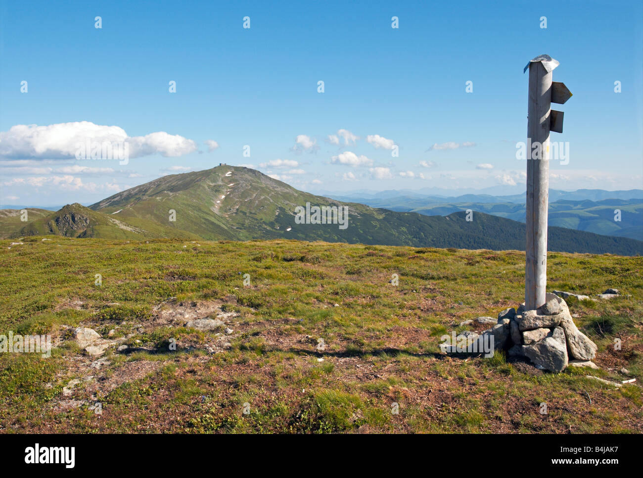 summer mountain landscape with direction sign Stock Photo - Alamy