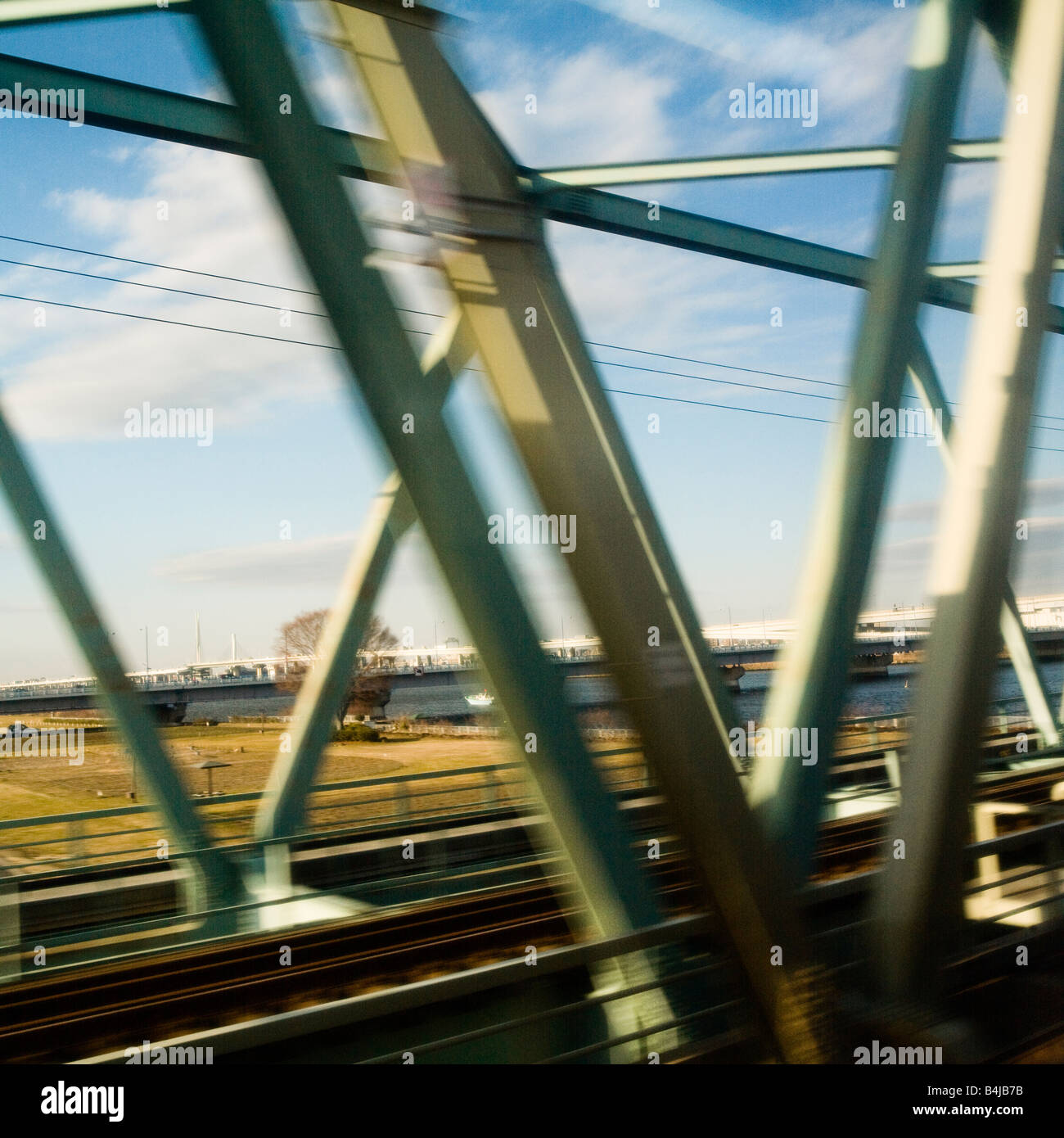 japan yokohama train window steel bridge solitary cloud blue sky speed ...