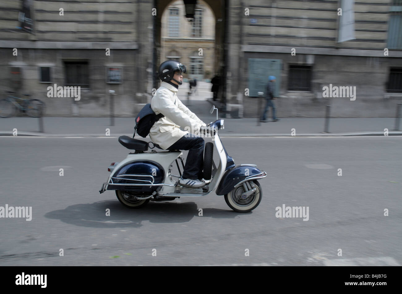 Man riding a Vespa scooter in Paris, France Stock Photo - Alamy