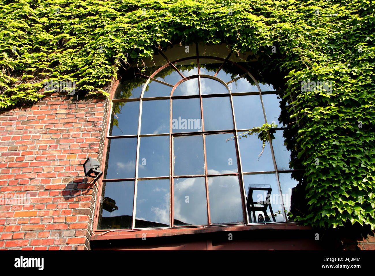 Window with Reflection of an old coal mine tower Stock Photo - Alamy
