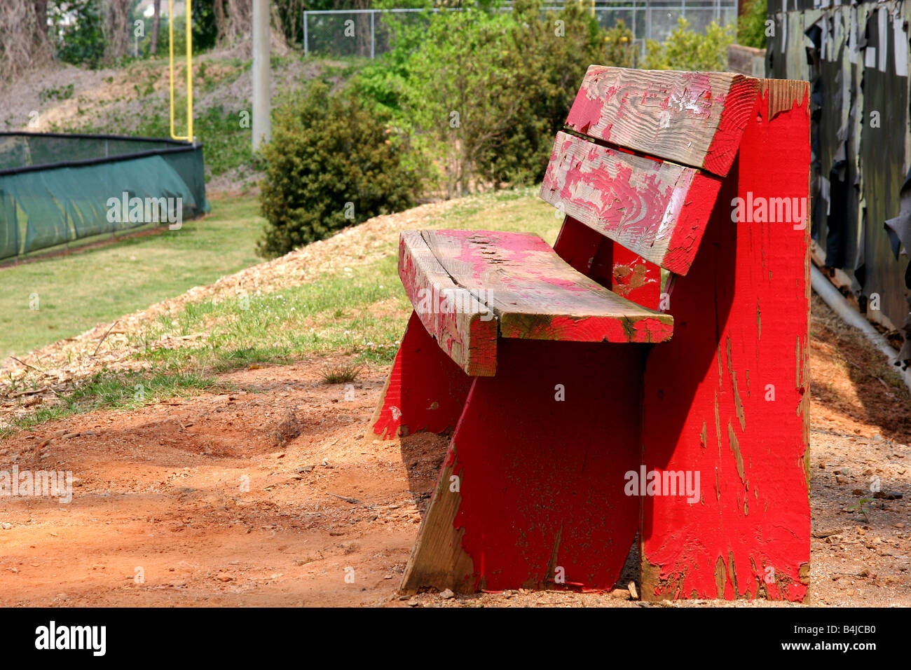 An old wooden bench with peeling red paint Stock Photo - Alamy