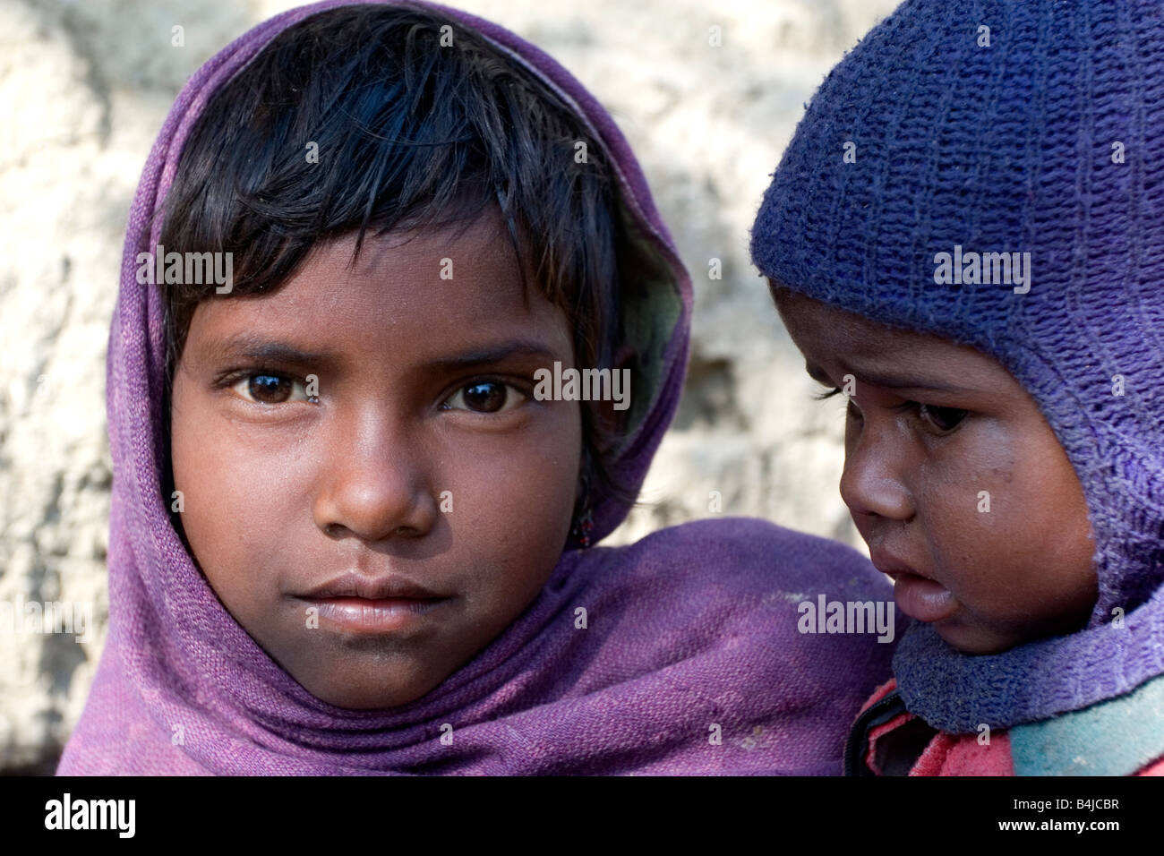 A tribal girl shares a happy moment with his brother at a tribal ...