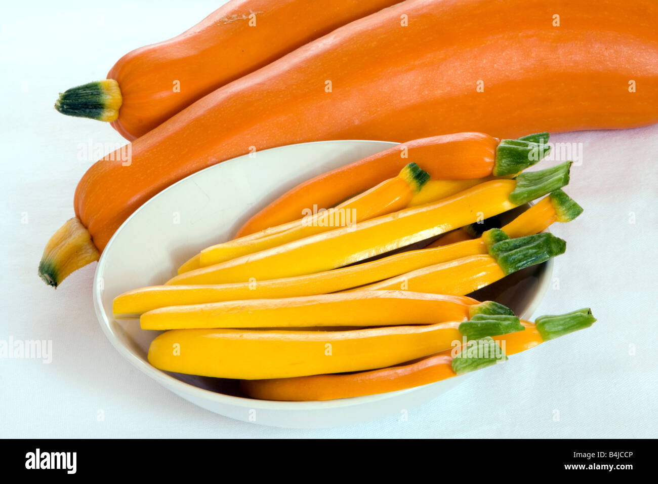 Fresh orange and yellow zucchini or courgettes Stock Photo - Alamy